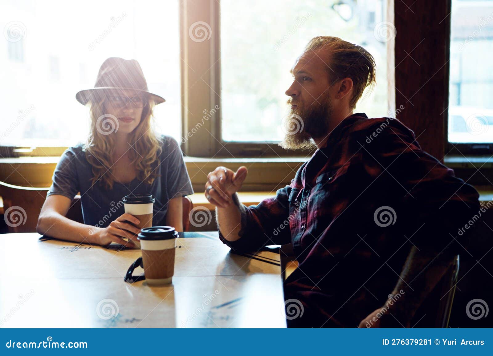 Hipsters at the Coffee Shop. a Hipster Couple in a Coffee Shop. Stock ...