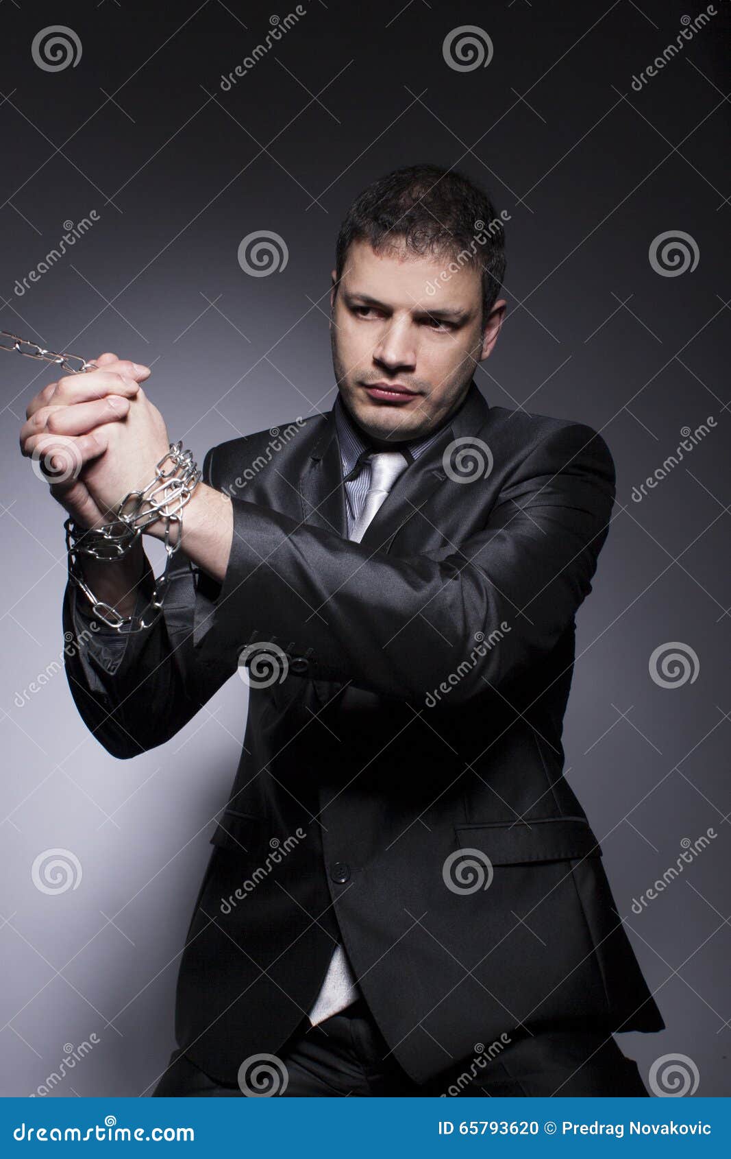 His hands are in chains stock photo. Image of grey, people - 65793620