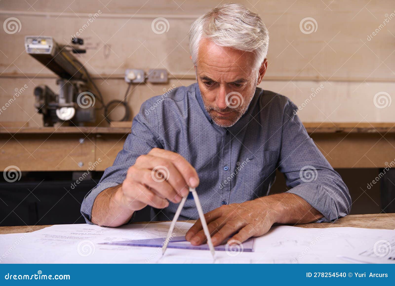 His Work is always Very Accurate. a Draftsman Using a Triangle and ...