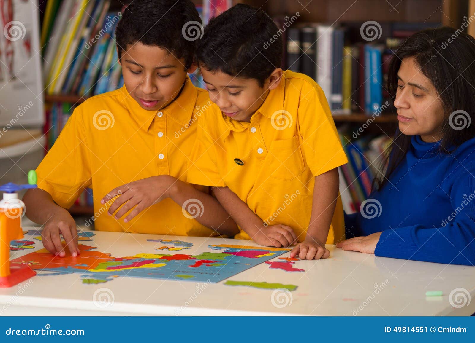 Hispanic Boys And Mom Working On Puzzle Stock Image - Image of ...