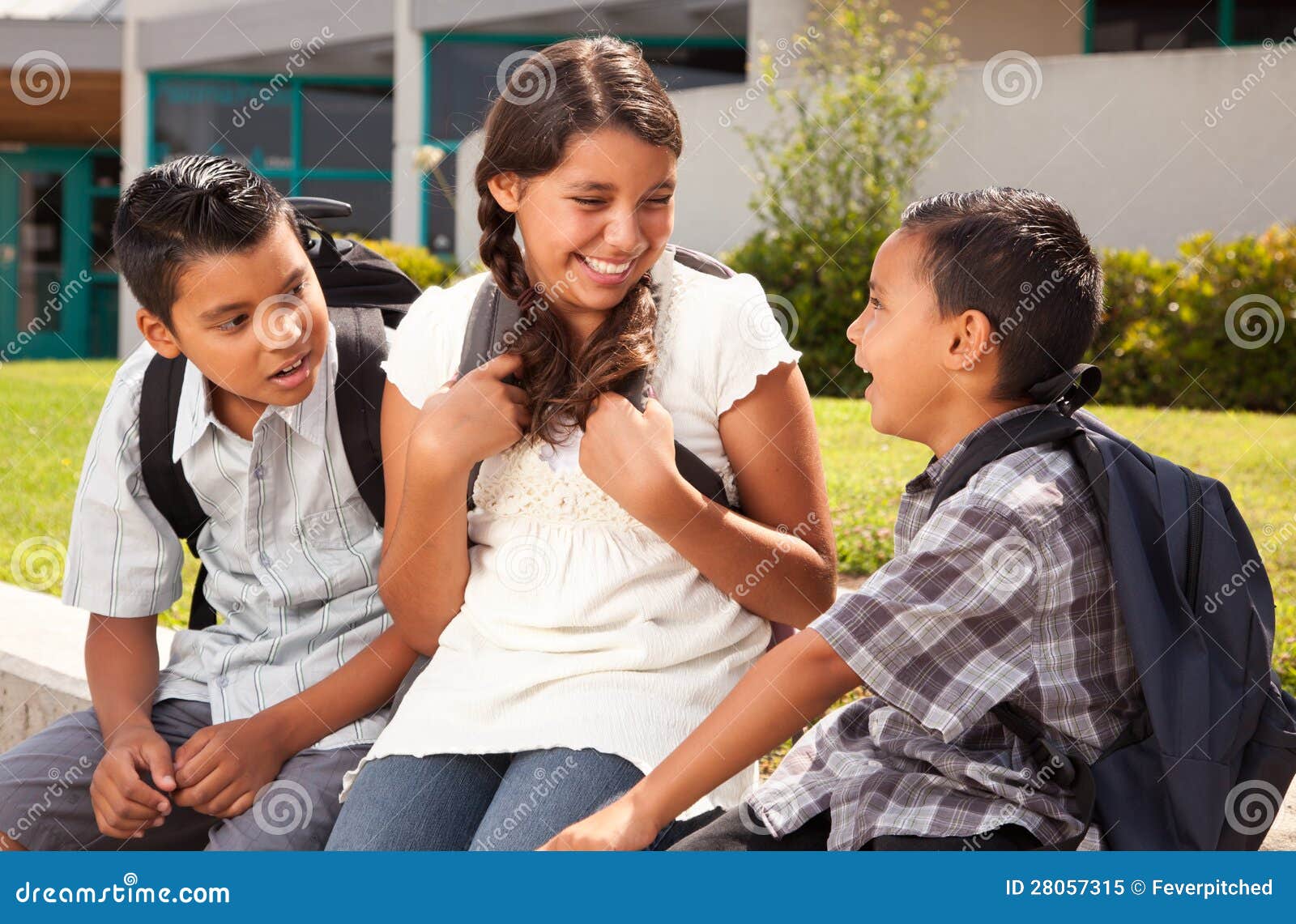 Hispanic Brothers and Sister Talking Ready for School Stock Image ...