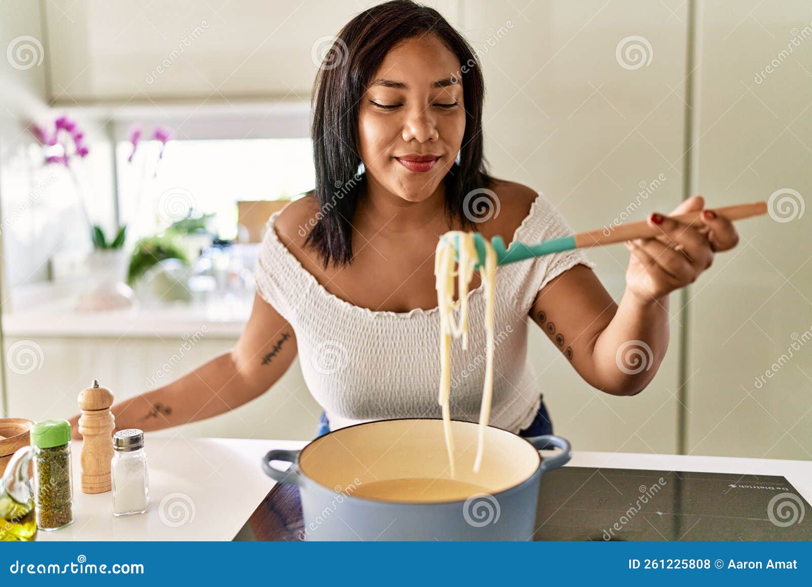 Hispanic Brunette Woman Cooking Spaghetti at the Kitchen Stock Photo ...