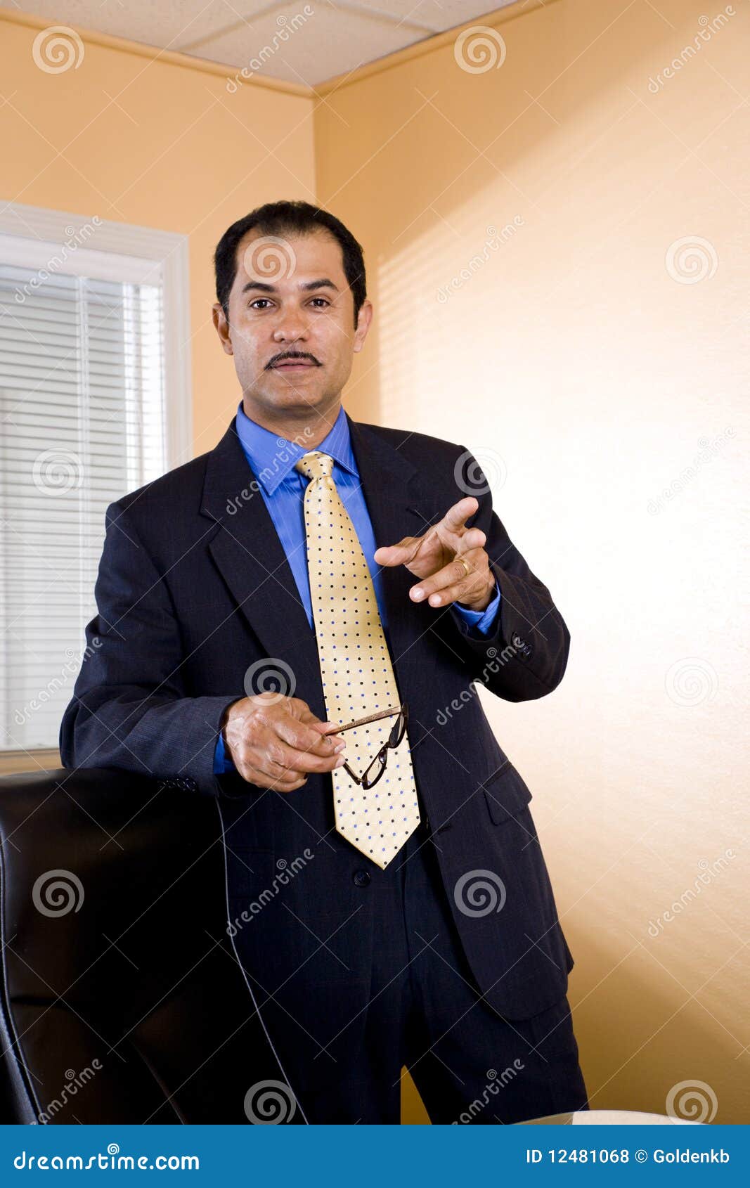 Hispanic Businessman Making a Point Stock Photo - Image of person ...