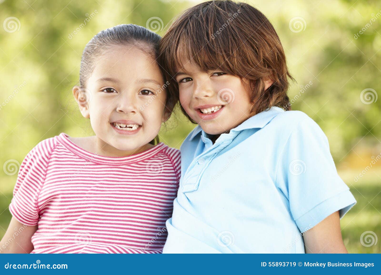 Hispanic Children Relaxing in Park Stock Image - Image of together ...