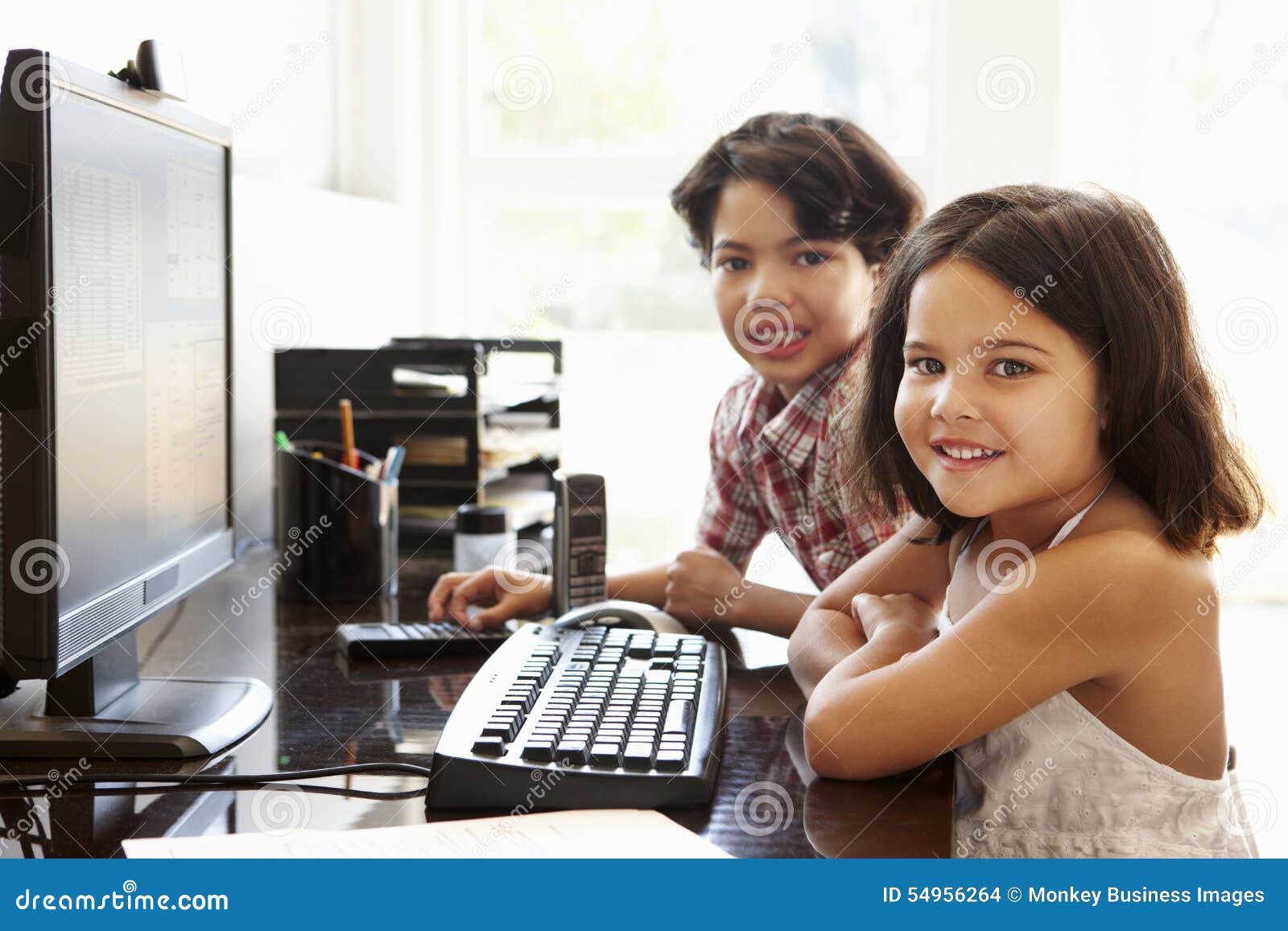Hispanic Children Using Computer at Home Stock Photo - Image of alone ...