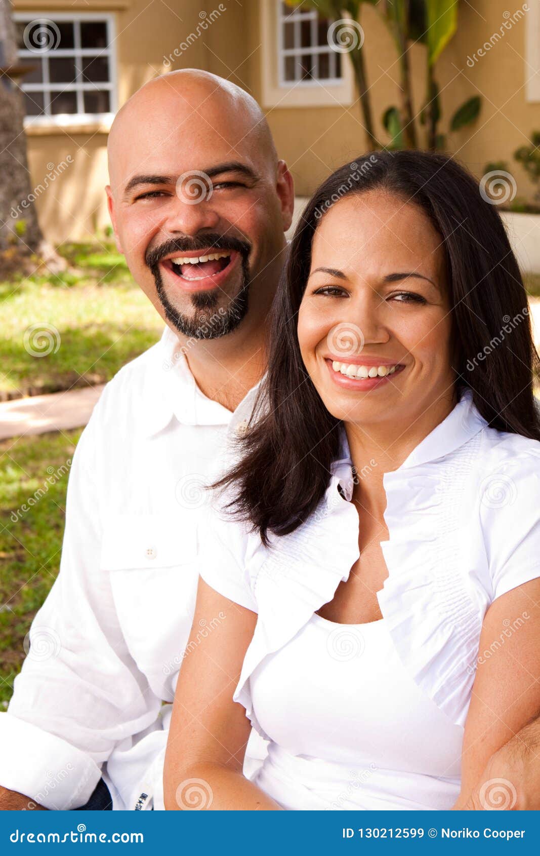Happy Hispanic Couple Laughing and Smiling Outside. Stock Image - Image ...