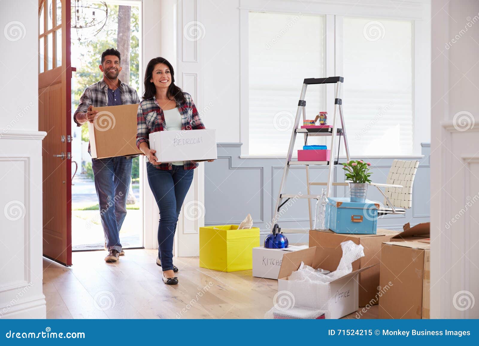 Hispanic Couple Moving into New Home Together Stock Image - Image of ...