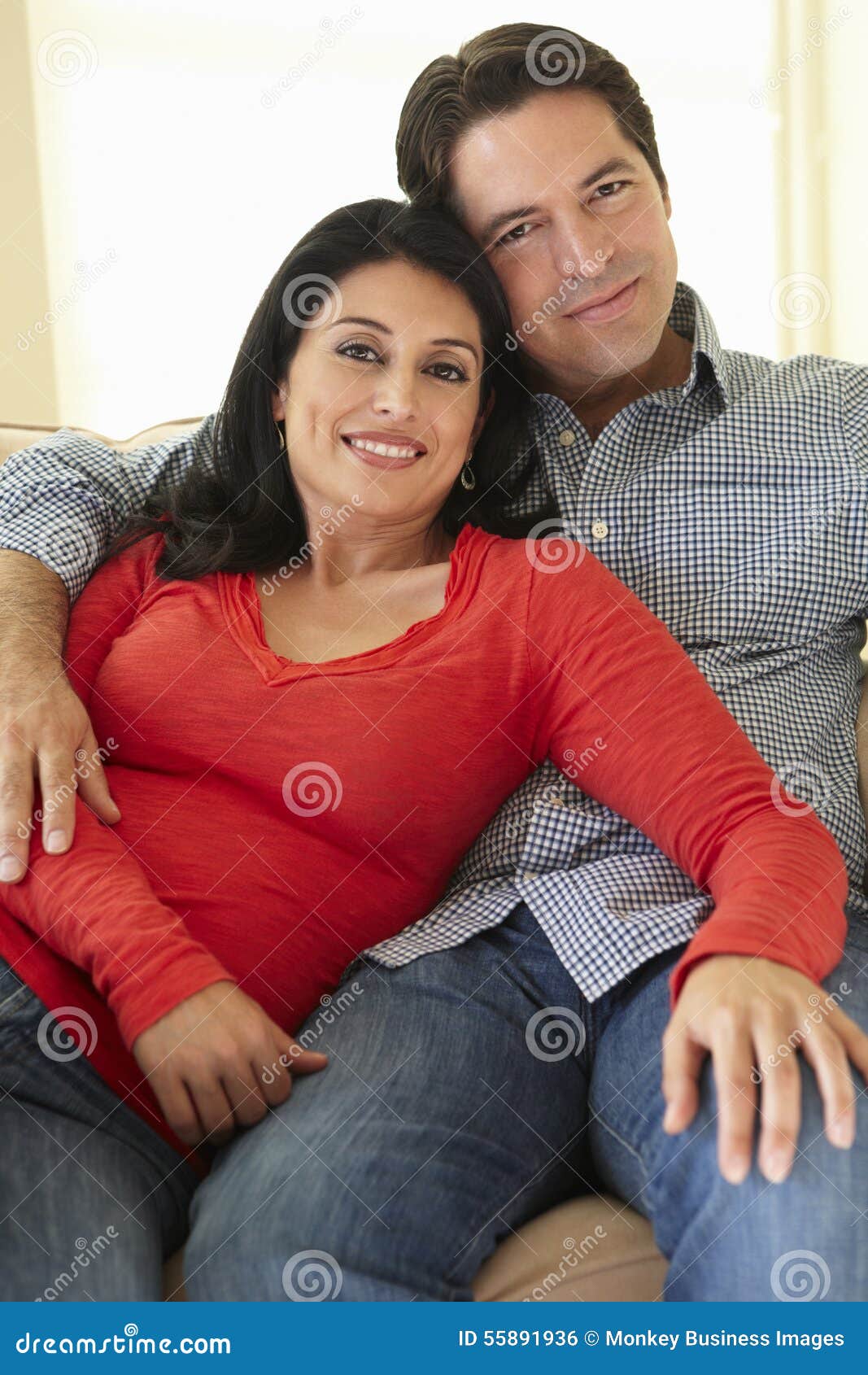 Hispanic Couple Relaxing at Home Stock Photo - Image of couple ...