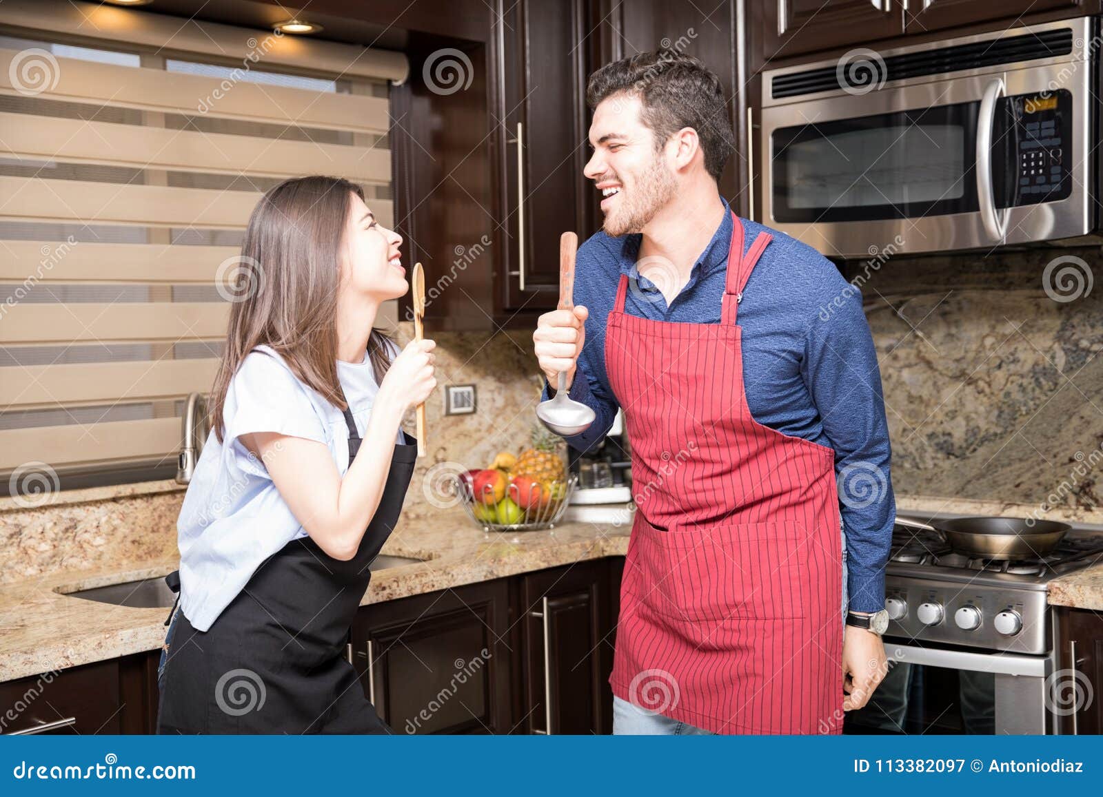 Hispanic Couple Singing in the Kitchen Stock Image - Image of happy ...