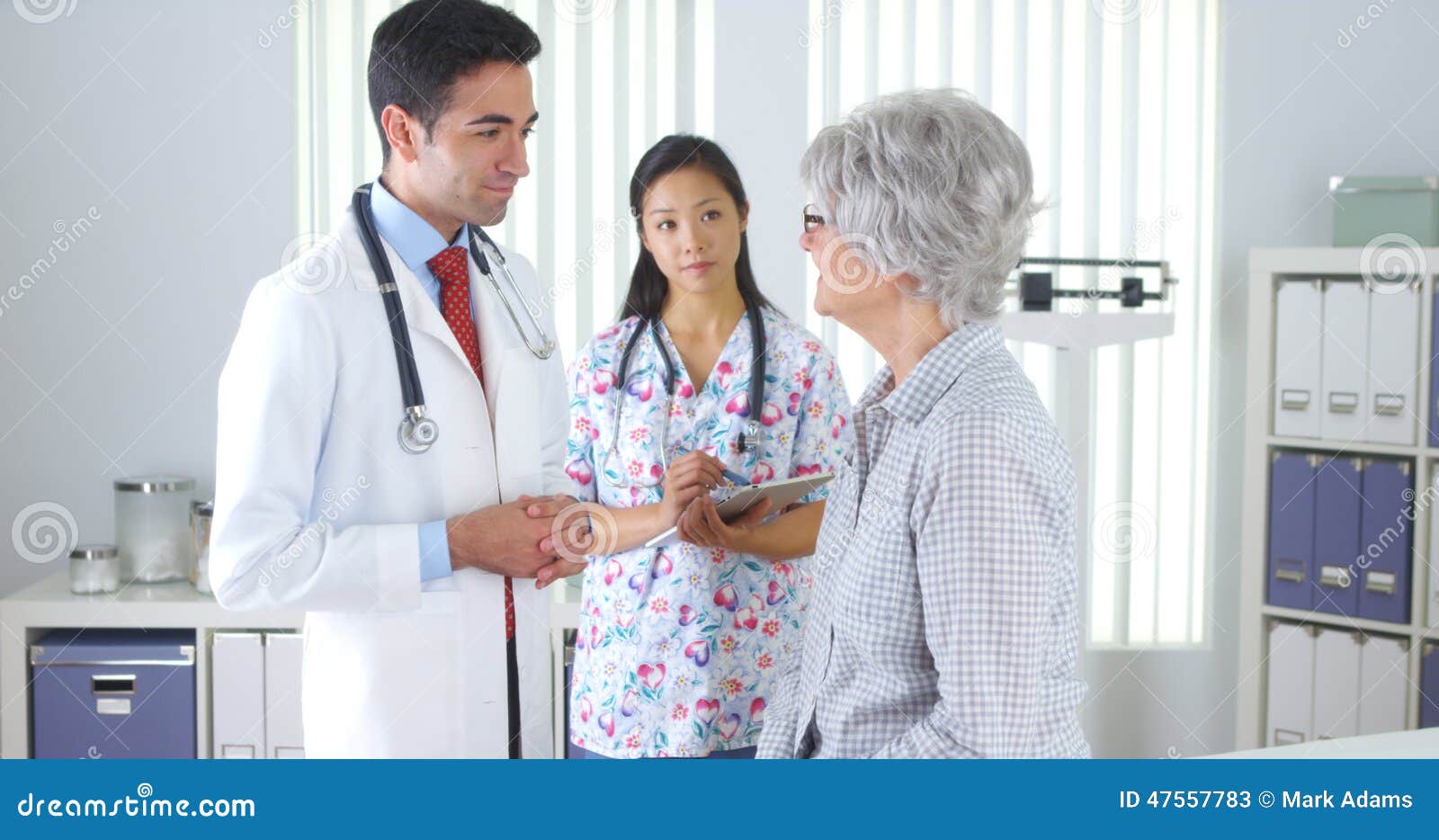 Hispanic Doctor Talking with Elderly Patient Stock Image - Image of ...