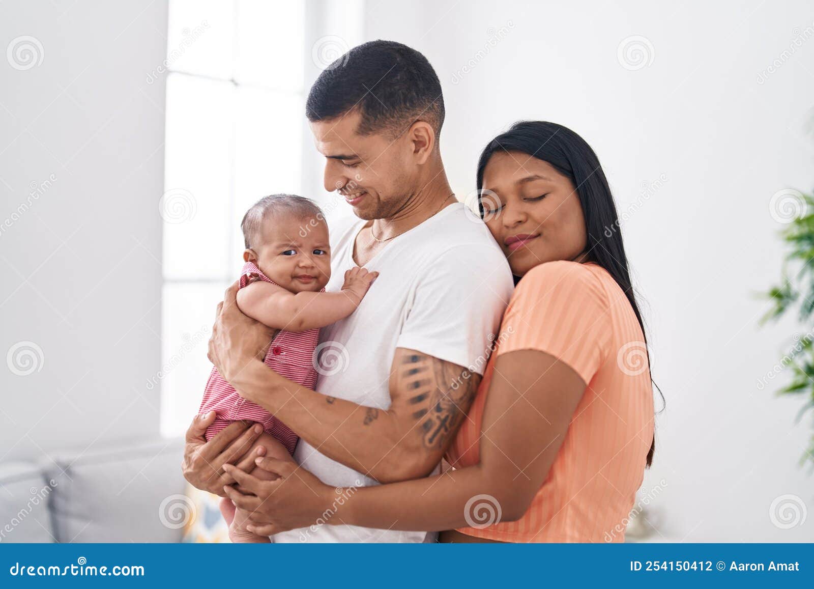 Hispanic Family Hugging Each Other Standing at Home Stock Photo - Image ...
