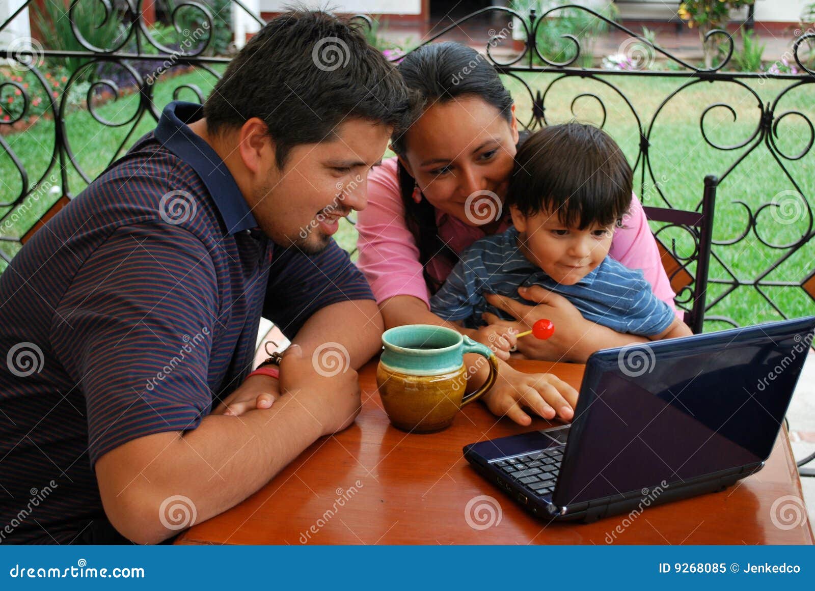 Hispanic family on laptop stock image. Image of education - 9268085
