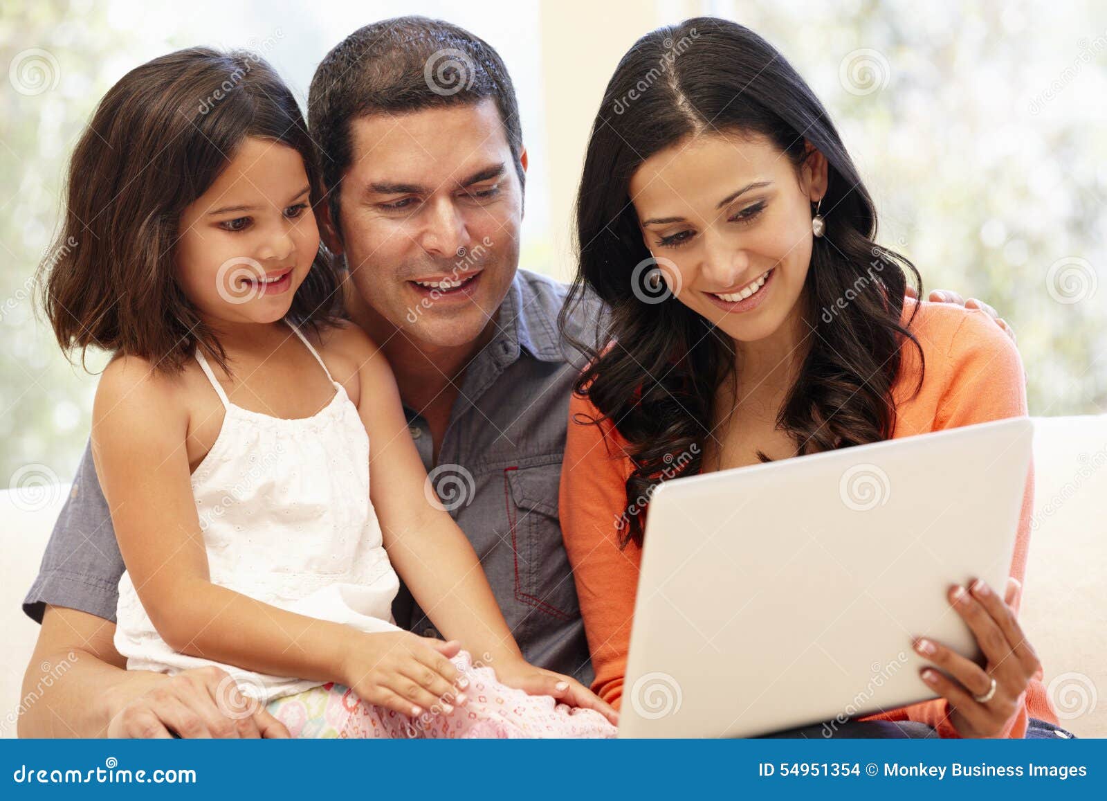 Hispanic Family with Laptop at Home Stock Photo - Image of relaxed ...