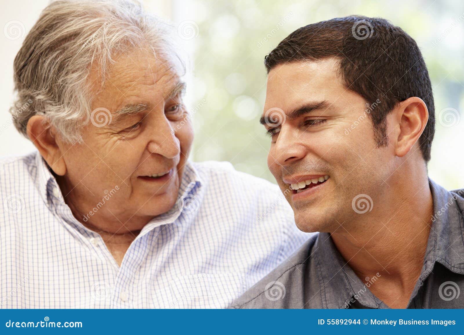Hispanic Father Of Interracial Family Drinking A Cup Coffee Laughing ...