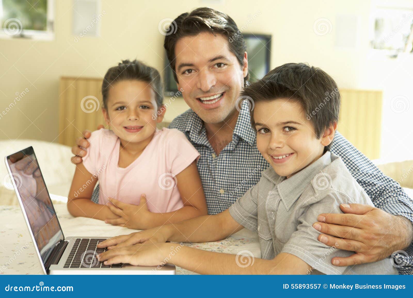 Hispanic Father and Children Using Computer at Home Stock Image - Image ...