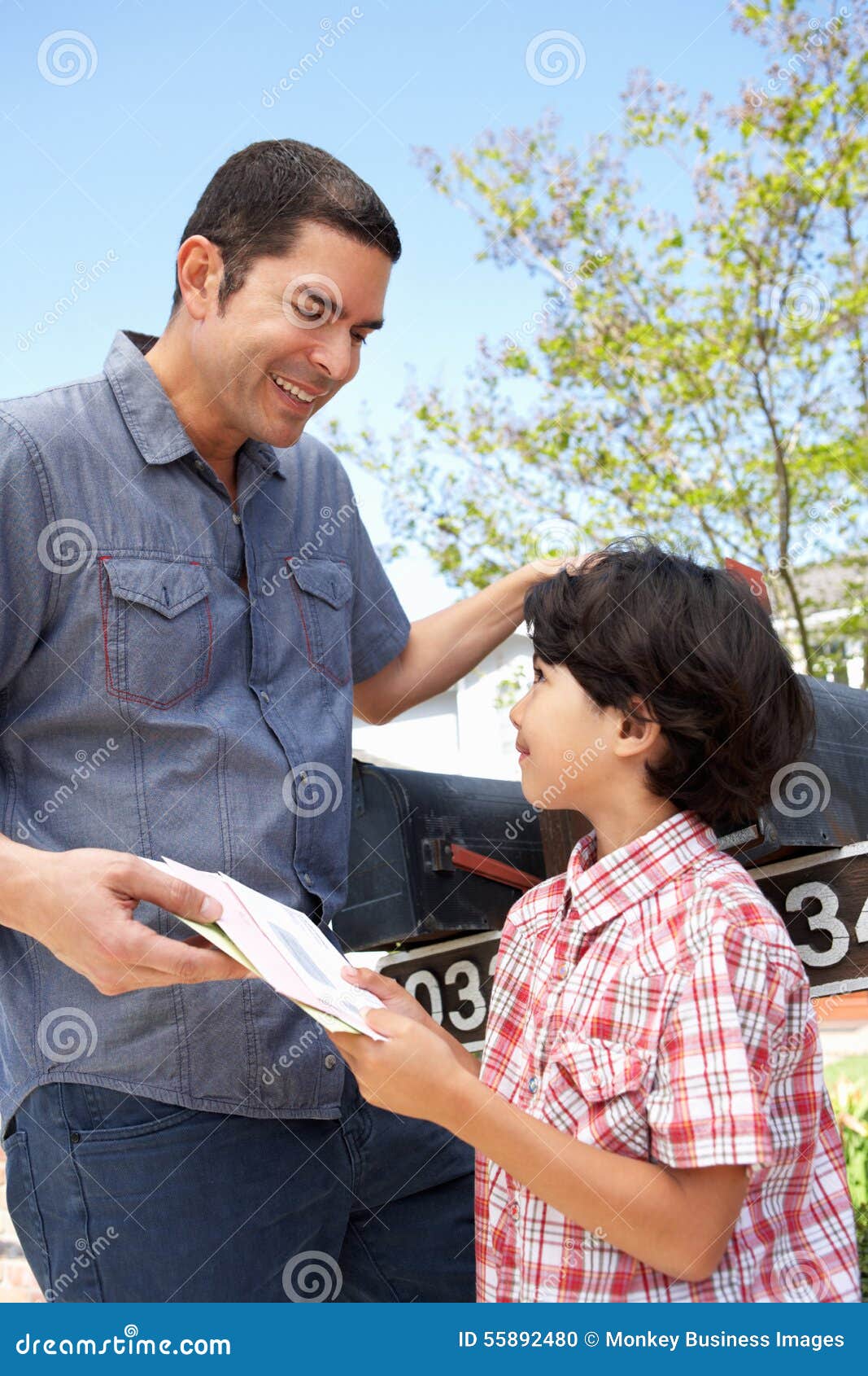 Hispanic Father and Son Checking Mailbox Stock Photo - Image of ...