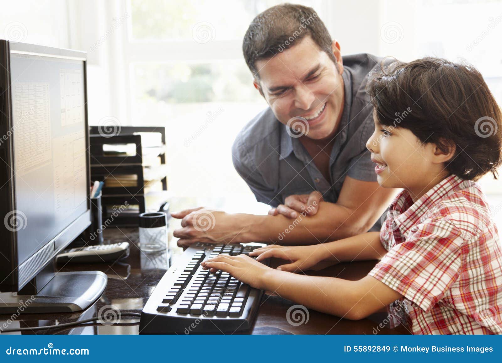 Hispanic Father and Son Using Computer at Home Stock Image - Image of ...