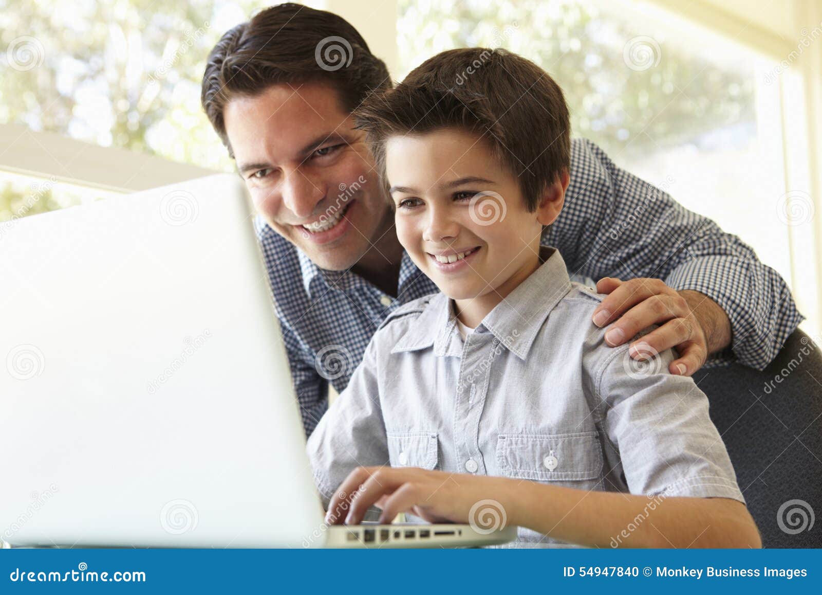 Hispanic Father and Son Using Laptop Stock Photo - Image of computer ...