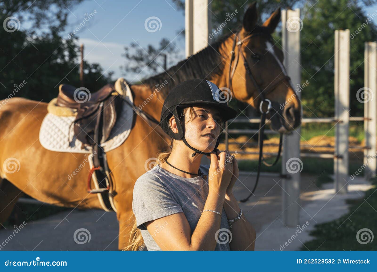 Hispanic Female Rider Taking Off Her Helmet Stock Photo - Image of girl ...
