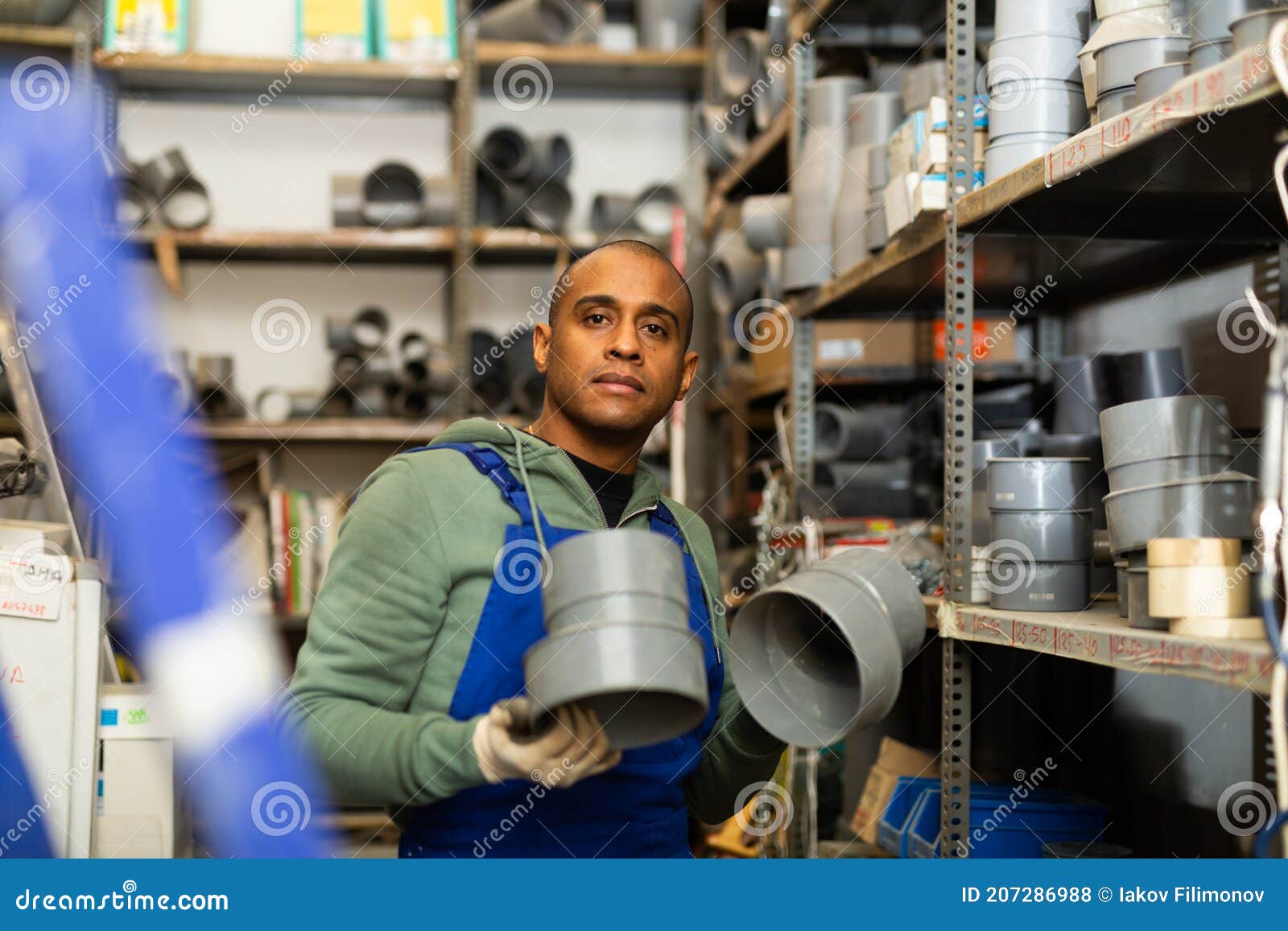 Hispanic Foreman Looking for Construction Supplies in Building ...