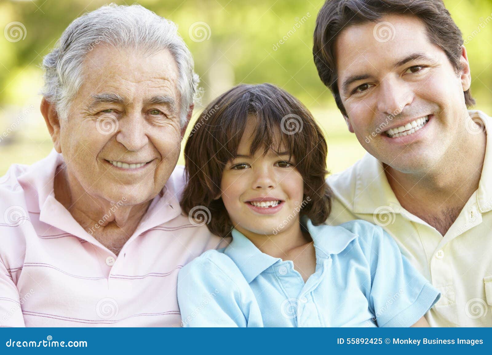 Hispanic Grandfather, Father And Son Relaxing In Park Royalty-Free ...