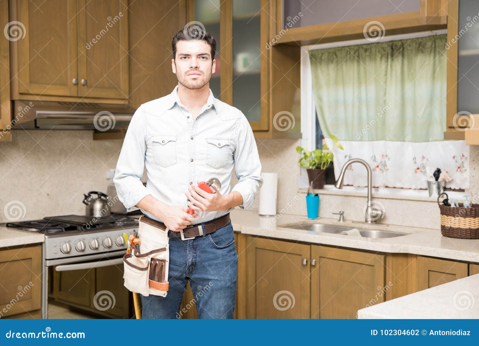 Hispanic handyman at work stock photo. Image of young - 102304602