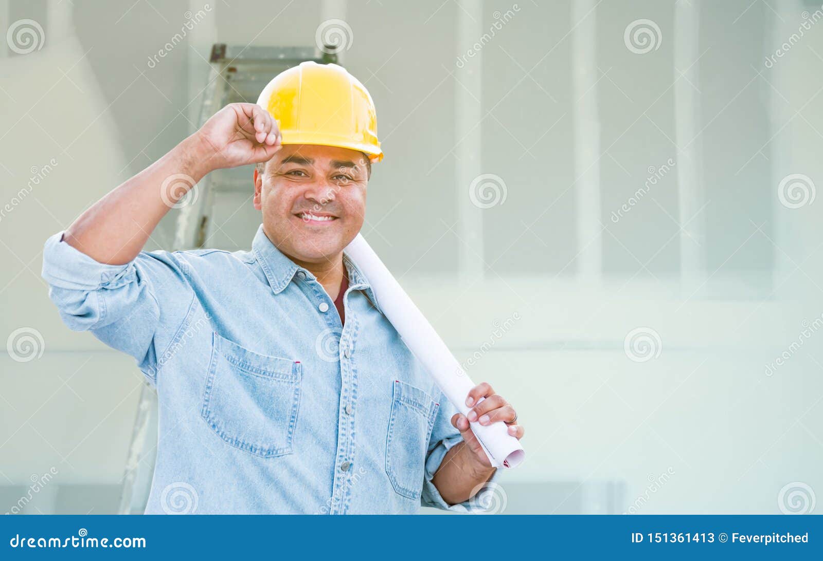 Hispanic Male Contractor with Blueprint Plans Wearing Hard Hat in Front ... Hispanic Male Contractor with Blueprint Plans Wearing Hard Hat in Front ...