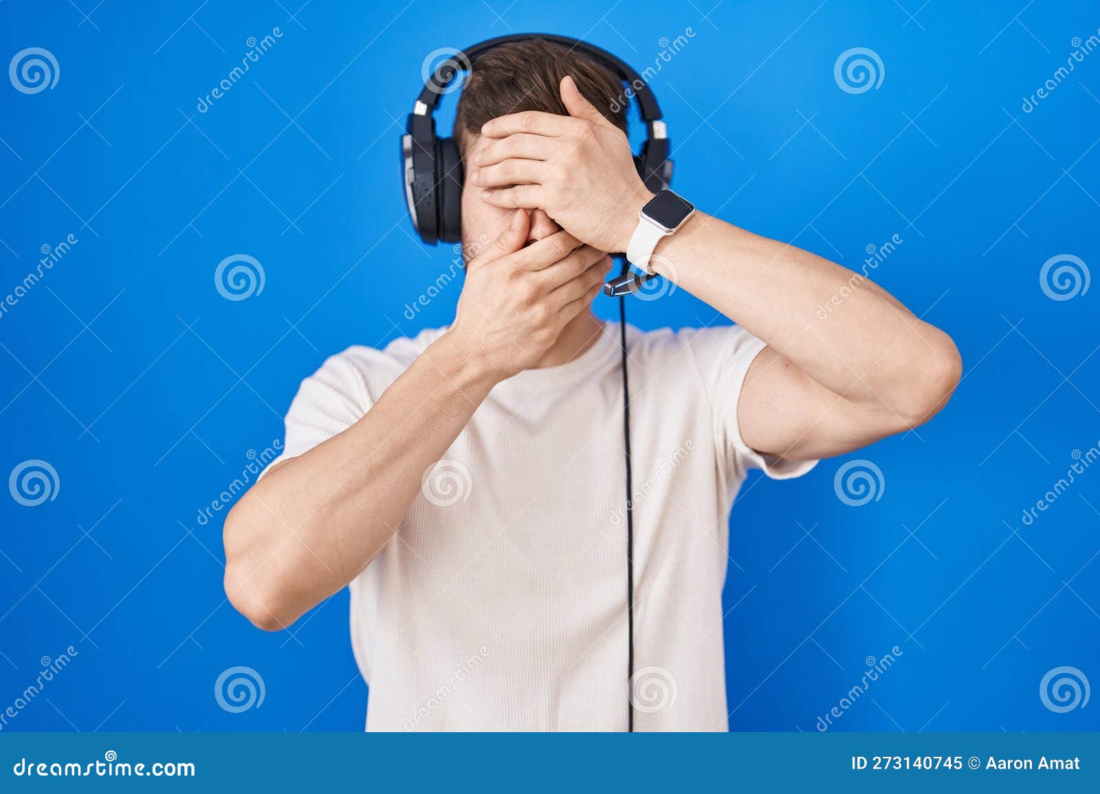Hispanic Man With Beard Listening To Music Wearing Headphones Covering