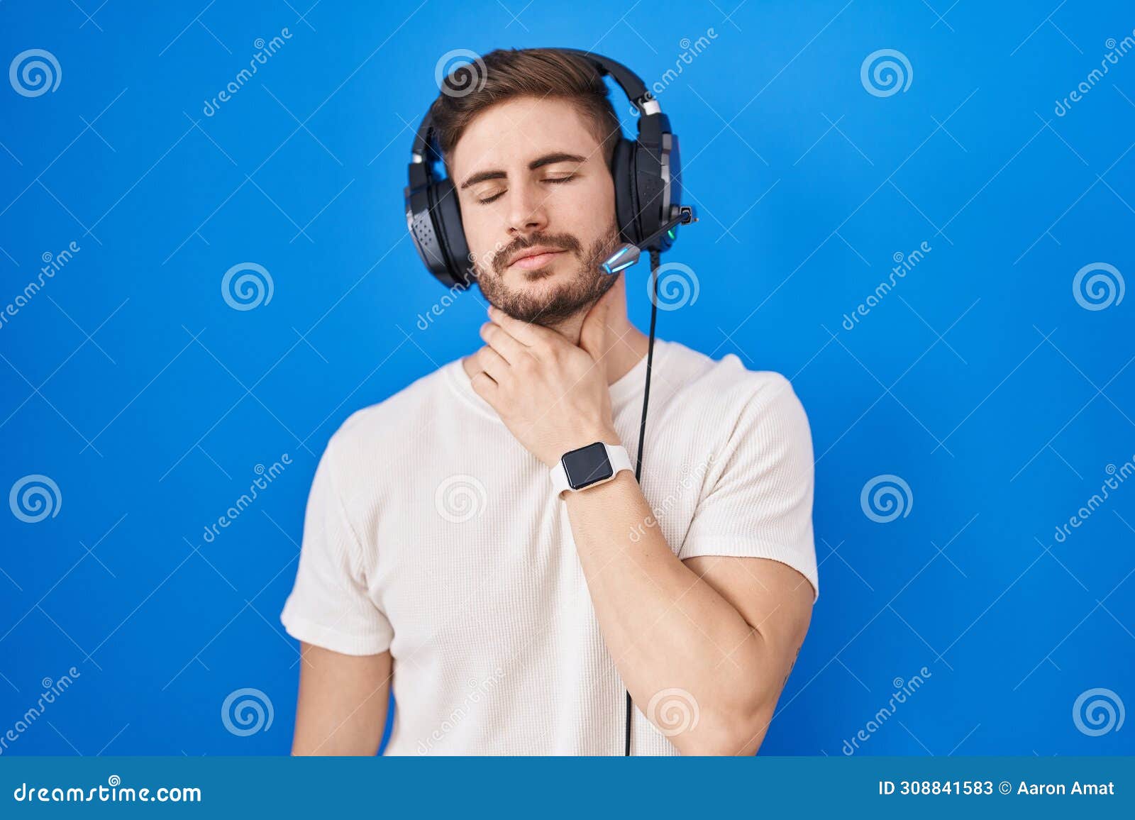 Hispanic Man With Beard Listening To Music Wearing Headphones Touching
