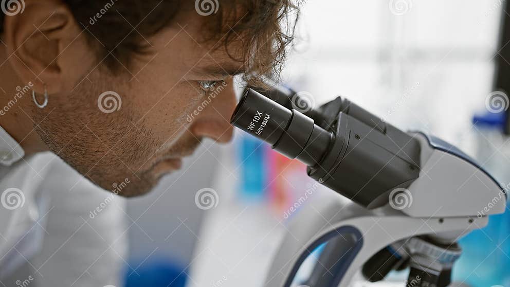 Hispanic Man with Beard Using Microscope in Laboratory Indoors Stock ...