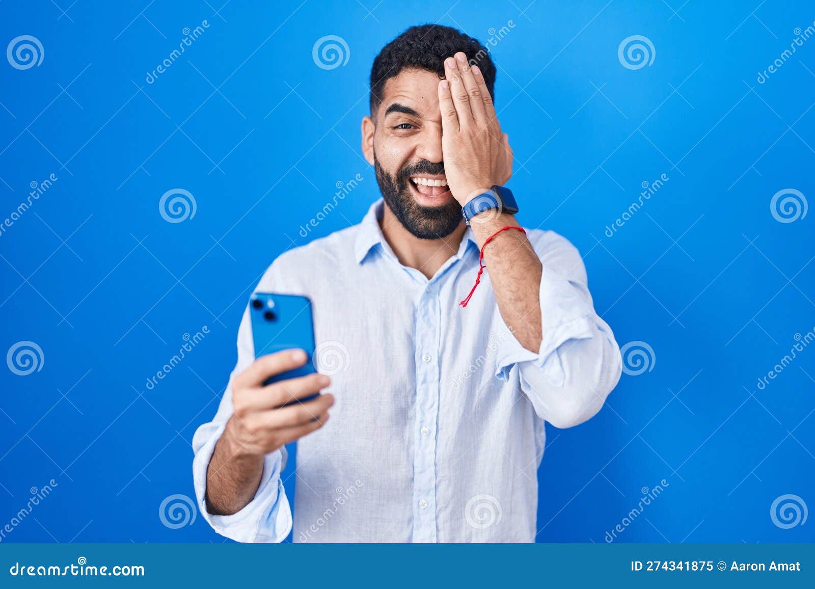 Hispanic Man With Beard Using Smartphone Typing Message Covering One