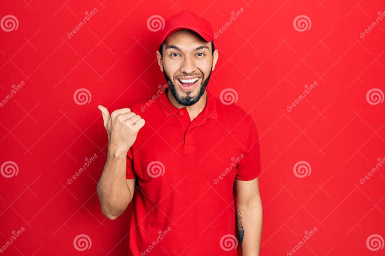 Hispanic Man With Beard Wearing Delivery Uniform And Cap Surprised