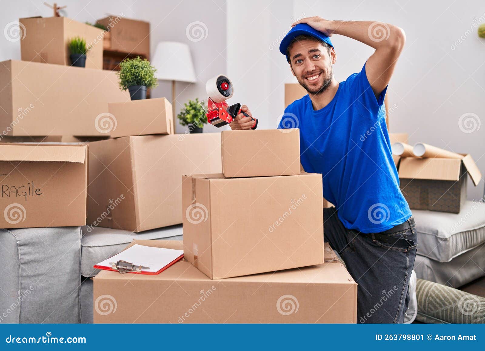 Hispanic Man with Beard Working Moving Boxes Stressed and Frustrated ...