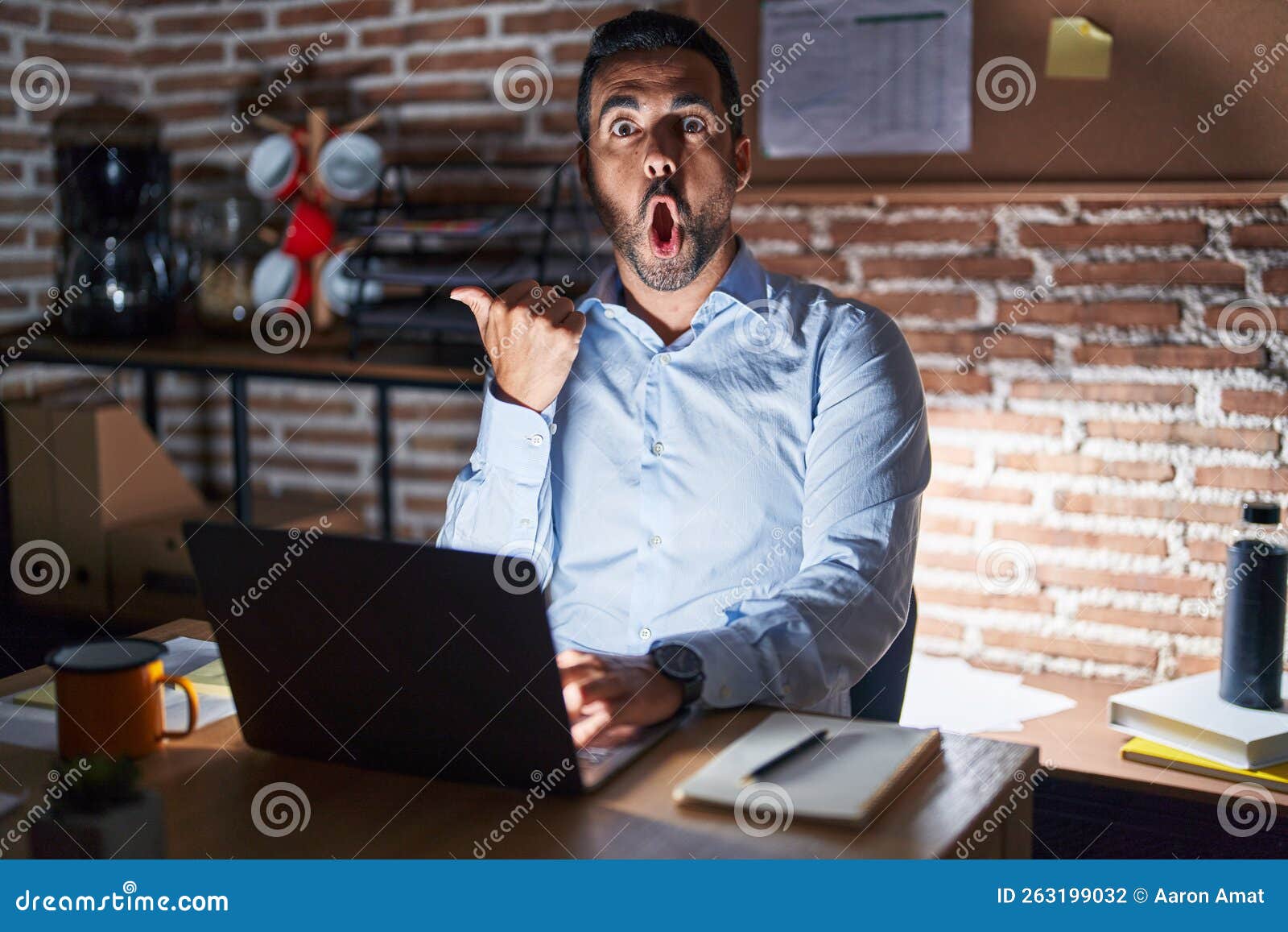 Hispanic Man with Beard Working at the Office at Night Surprised ...