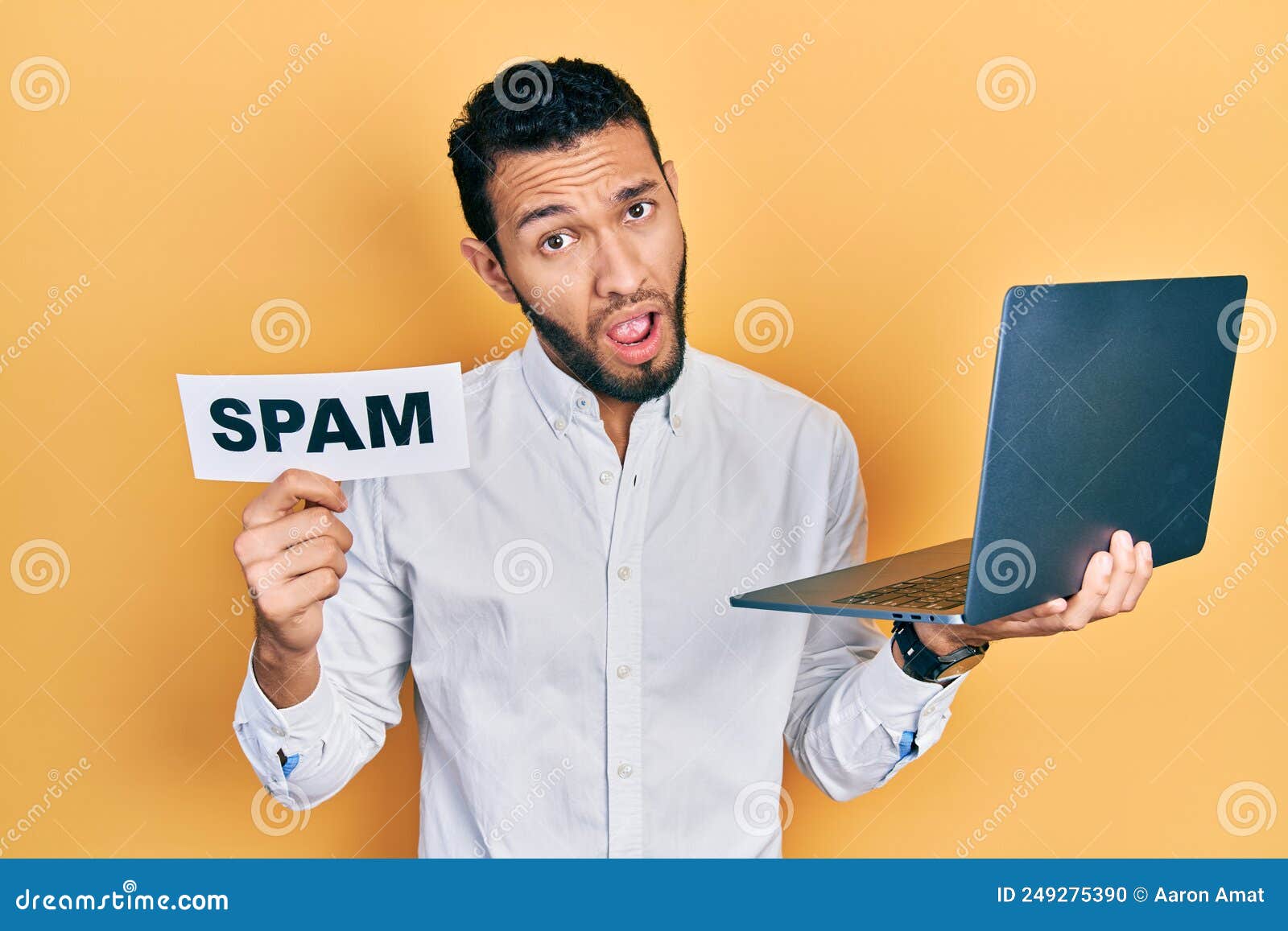 Hispanic Man with Beard Working Using Computer Laptop Holding Spam ...