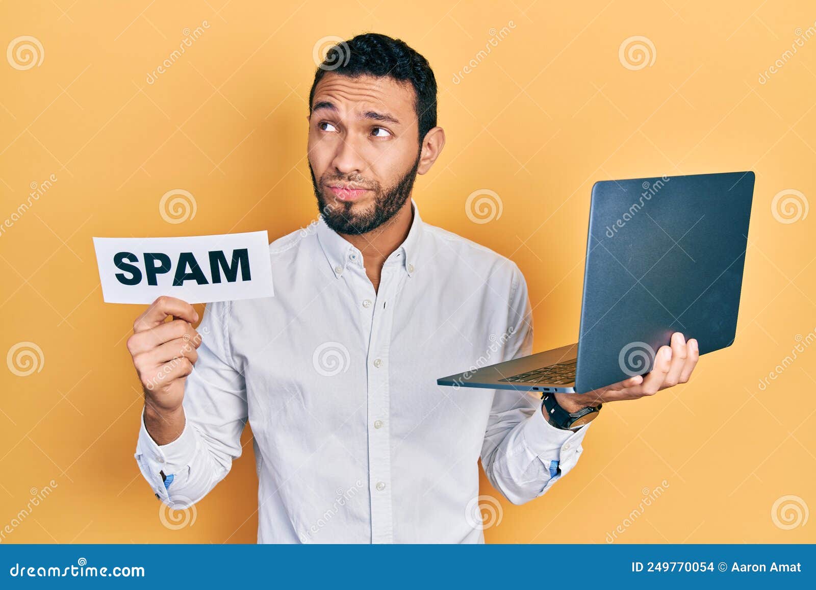 Hispanic Man with Beard Working Using Computer Laptop Holding Spam ...