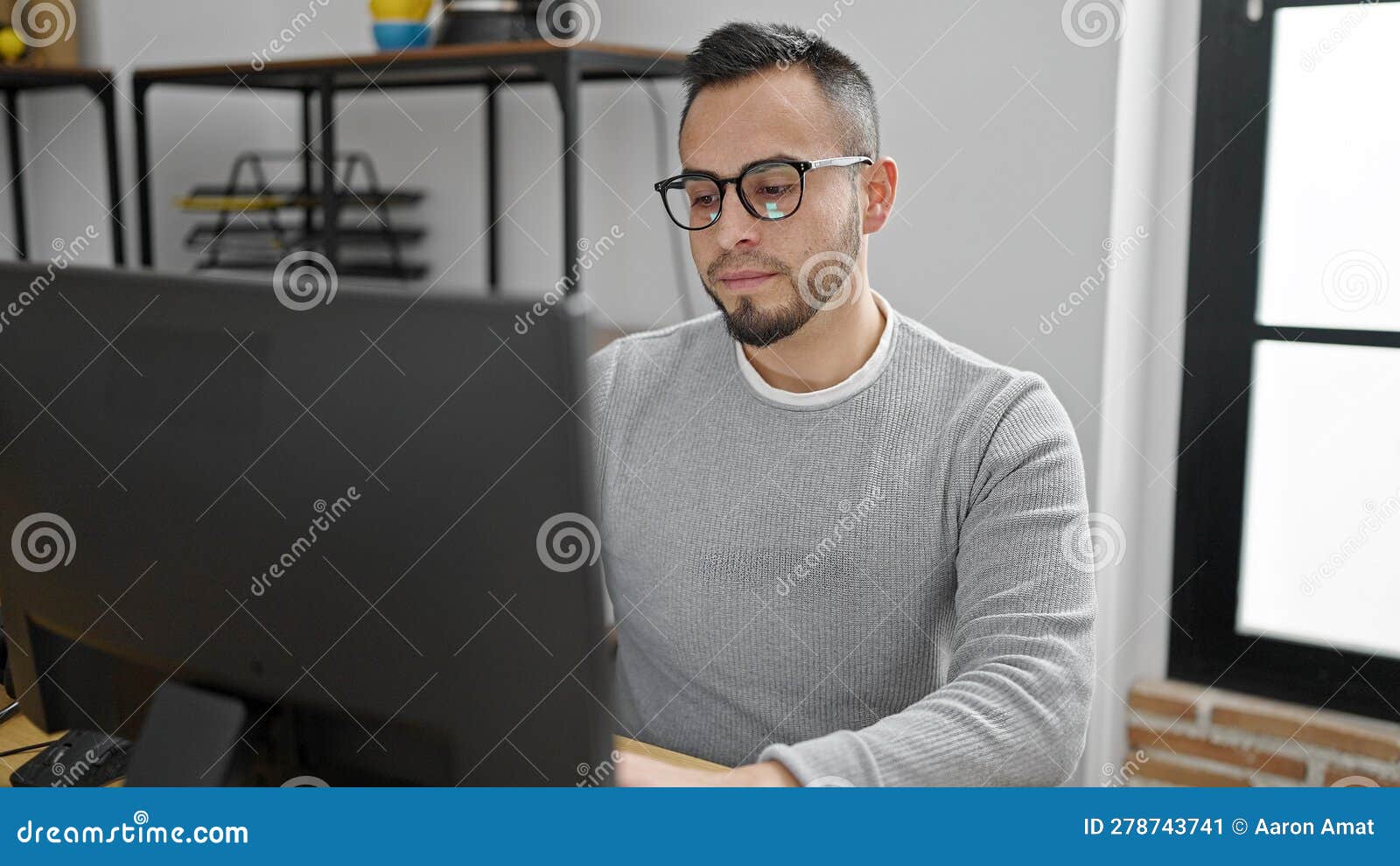 Hispanic Man Business Worker Using Computer with Serious Face at Office ...