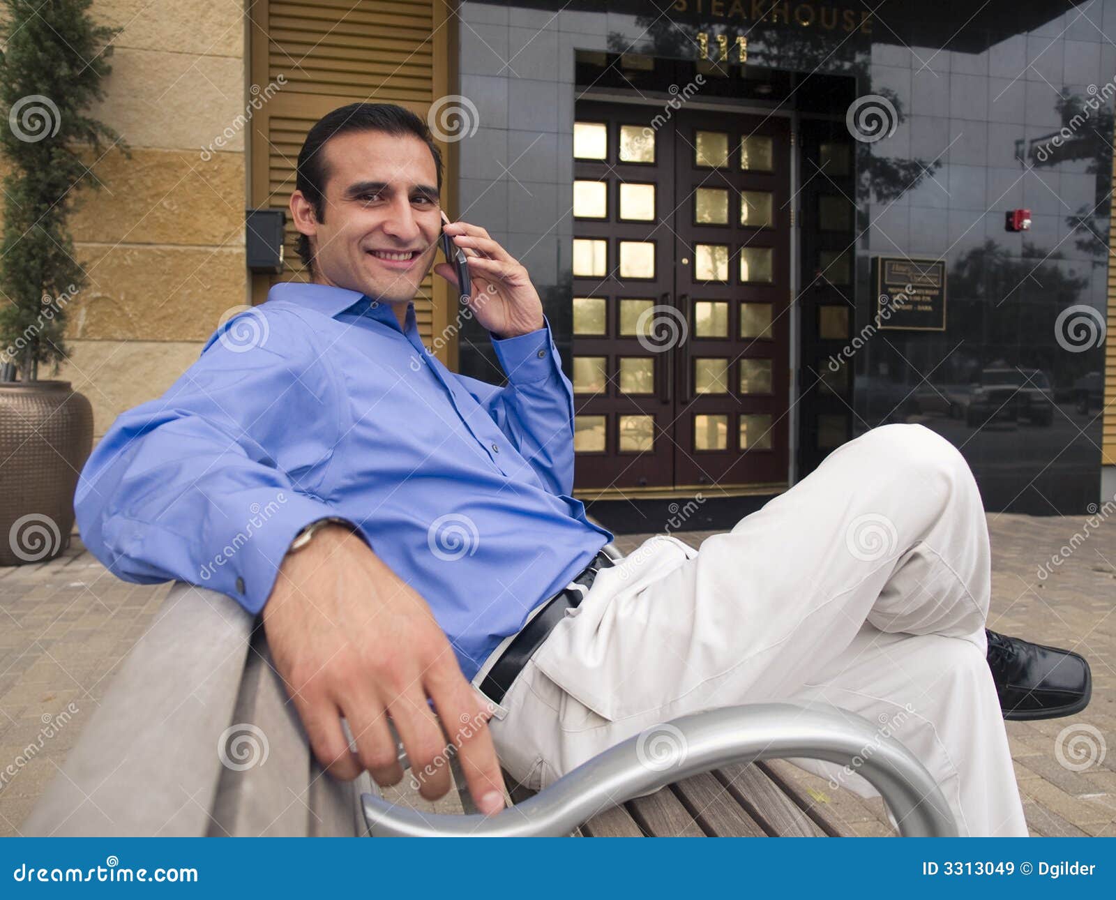 Hispanic Man with Cell Phone Stock Image - Image of communicating ...