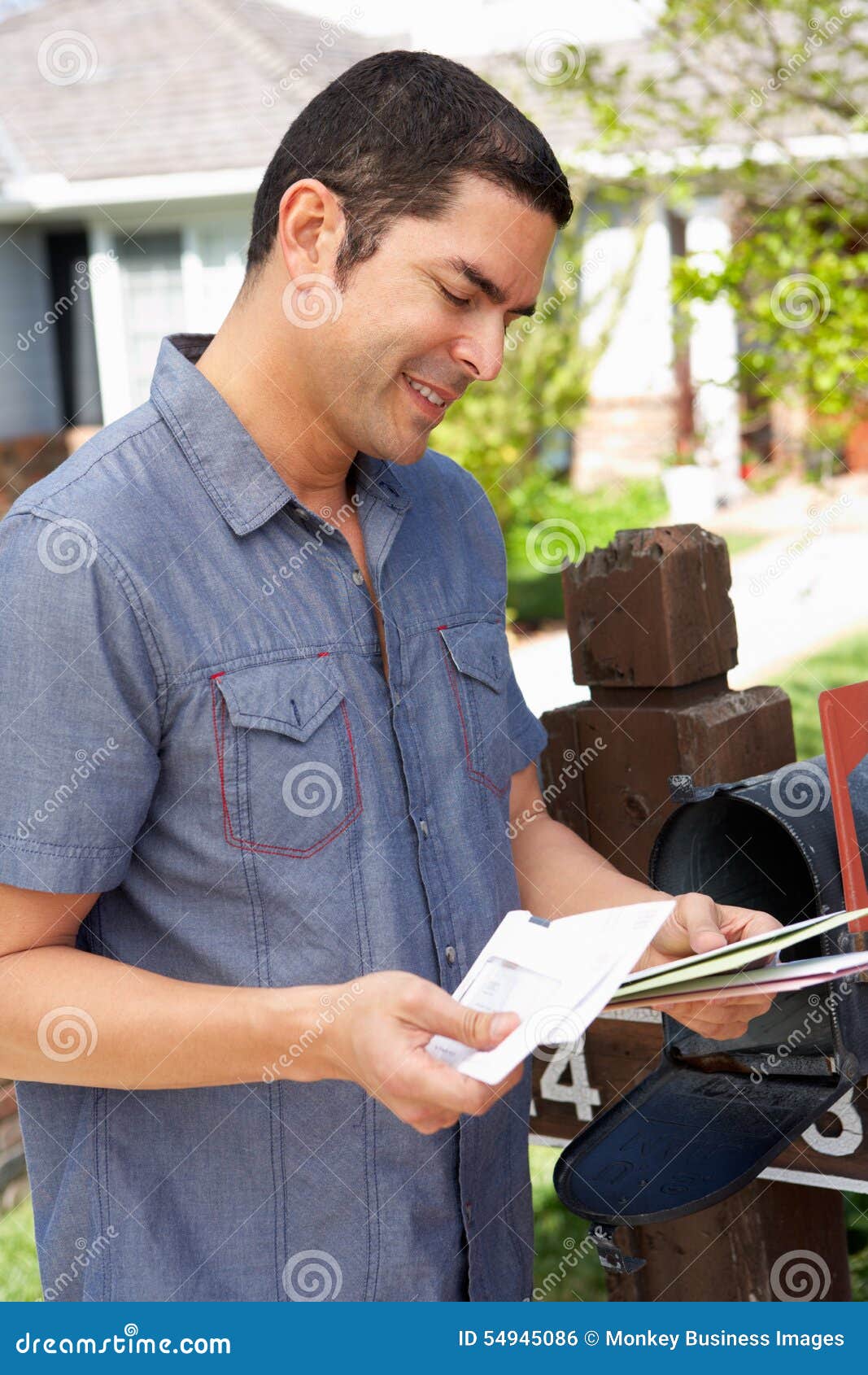 Hispanic Man Checking Mailbox Stock Photo - Image of middle, outdoors ...