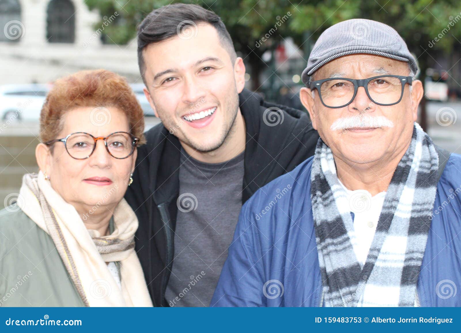 Hispanic Man with His Parents Outdoors Stock Image - Image of couples ...