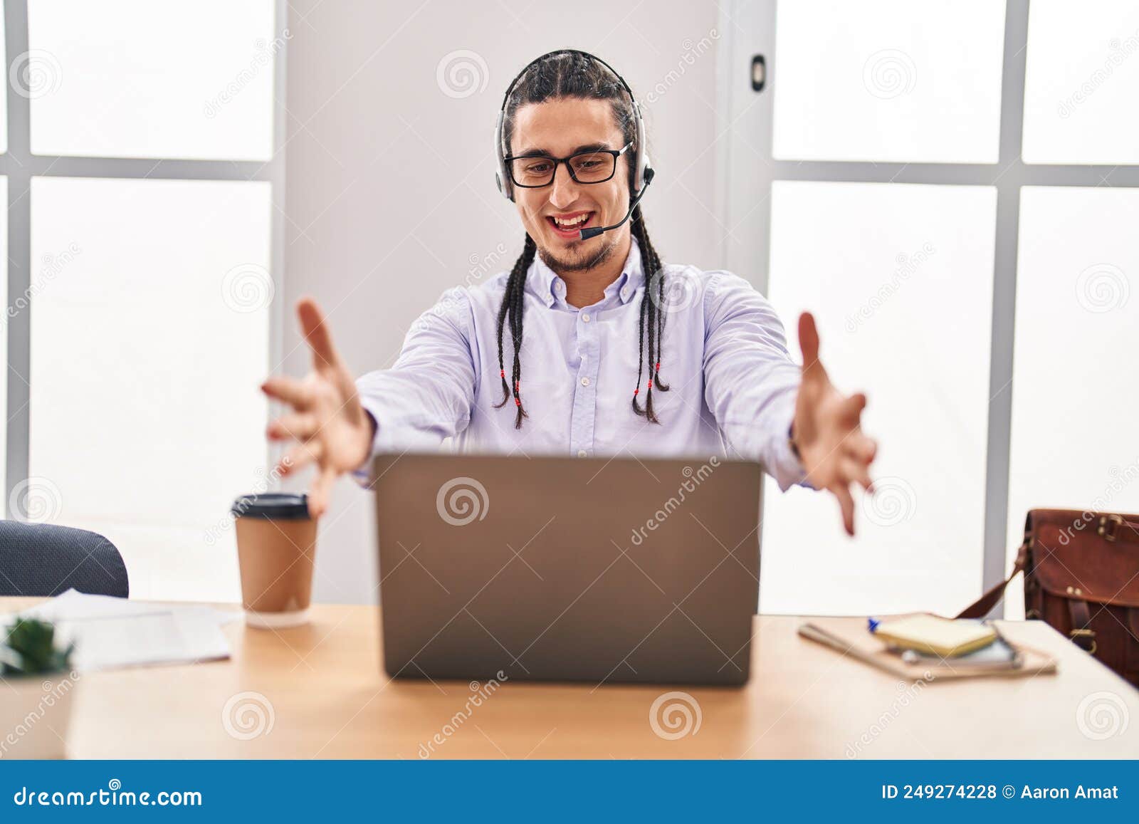 Hispanic Man with Long Hair Working Using Computer Laptop Looking at ...