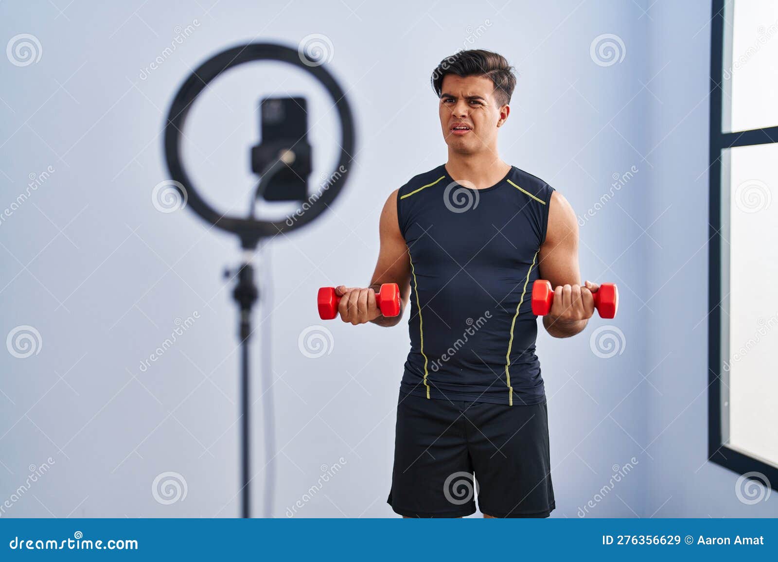 Hispanic Man Recording Training Tutorial at the Gym Clueless and ...