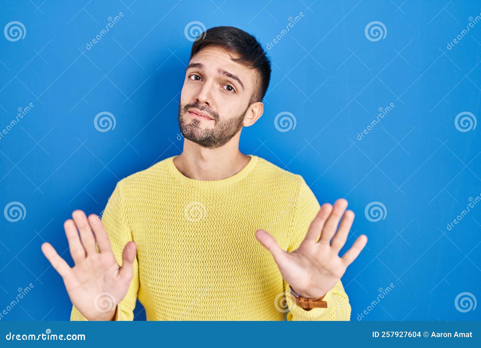 Hispanic Man Standing Over Blue Background Moving Away Hands Palms ...