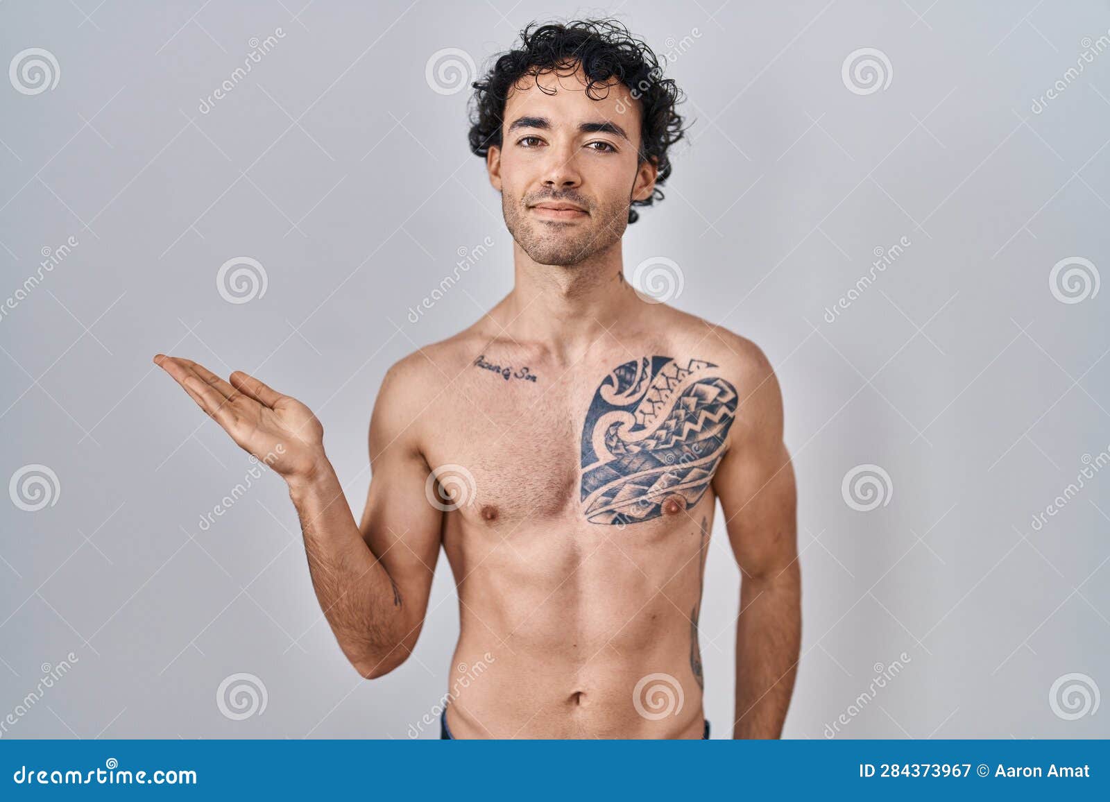 Hispanic Man Standing Shirtless Smiling Cheerful Presenting And