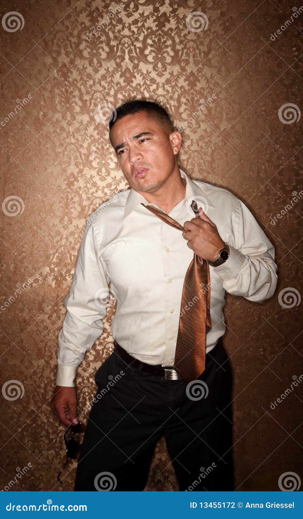 Hispanic Man Tugging at His Tie Stock Photo - Image of adult ...