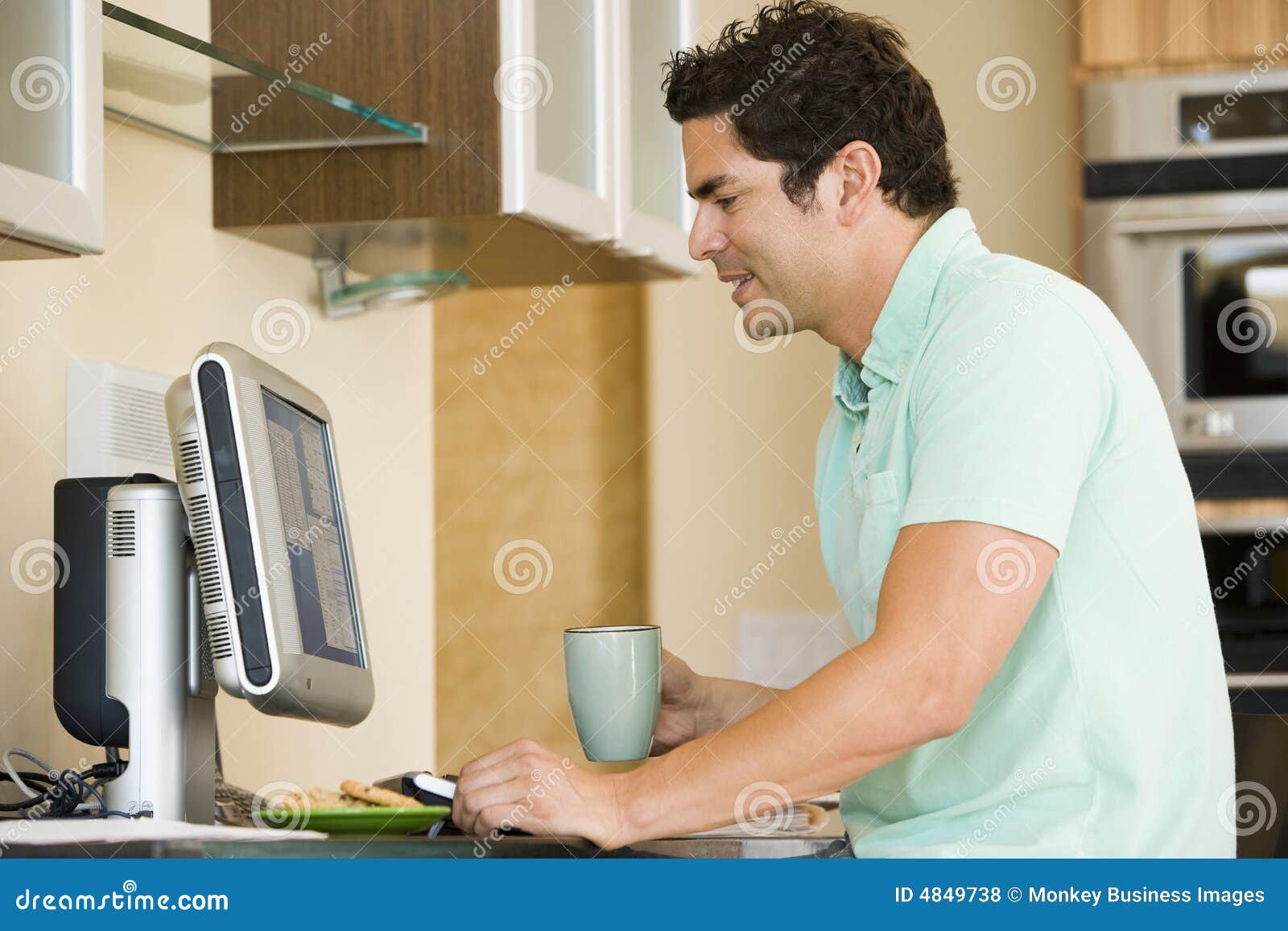 Hispanic Man Using Home Computer Stock Photo - Image of hispanic ...