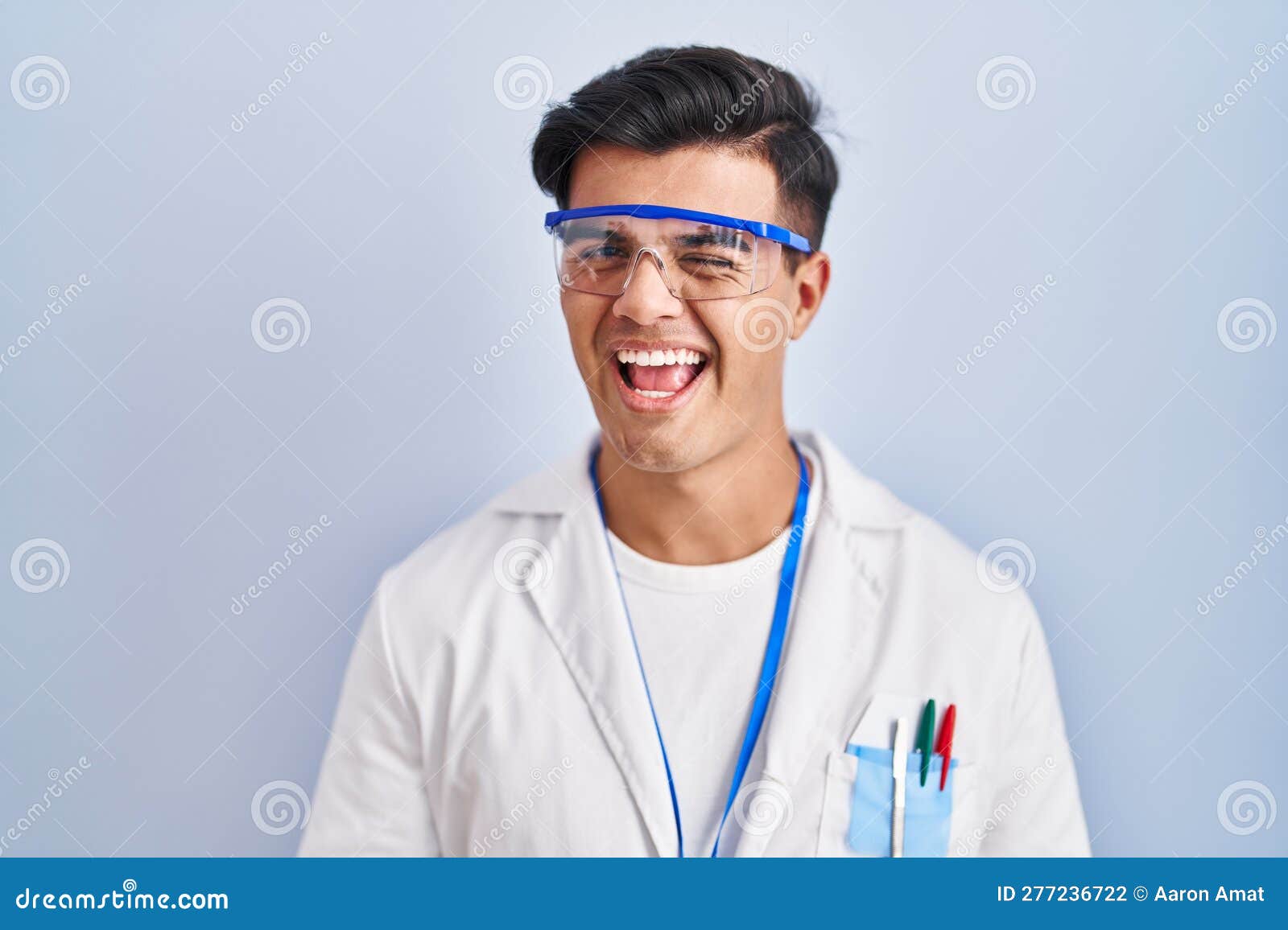 Hispanic Man Working As Scientist Winking Looking at the Camera with ...