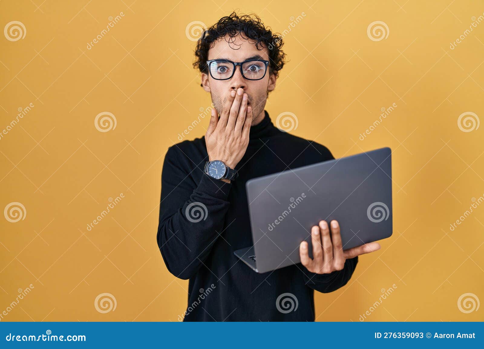 Hispanic Man Working Using Computer Laptop Covering Mouth with Hand ...