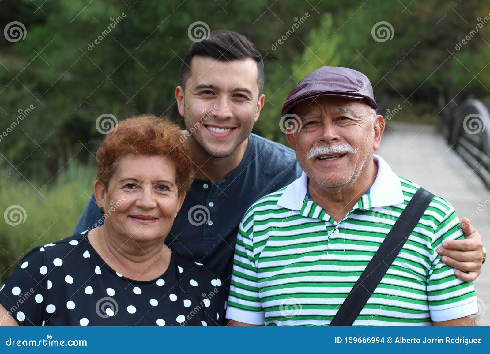 Hispanic Man with His Parents Outdoors Stock Photo - Image of family ...