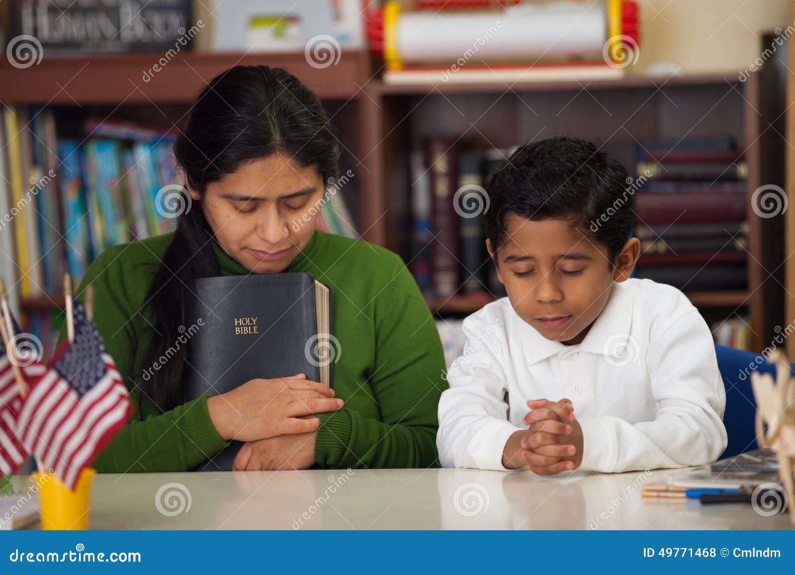 Hispanic Mom and Boy Praying in Home-school Setting during Worship ...